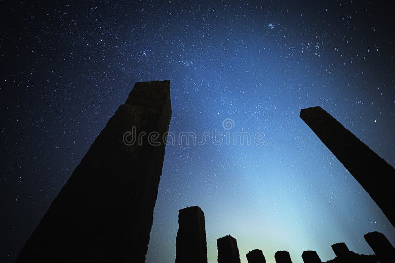 Stunning Low Angle Shot of the Nighttime Sky with Stone Structures in ...