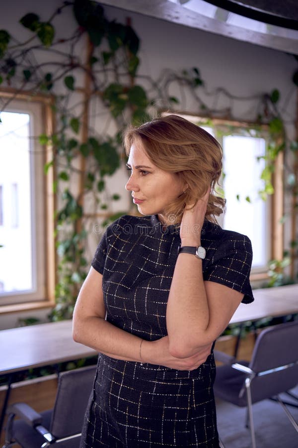 Stunning Model in Business Mini Dress Posing in Modern Office Space ...