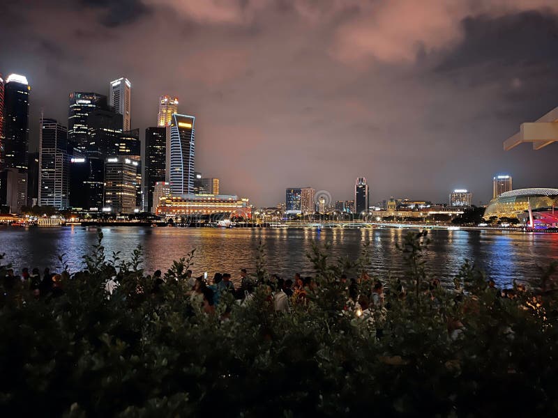 A Stunning Night View with Golden Light Near the Water Stock Photo ...