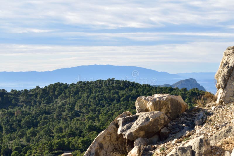 Panoramic Mountain Scene in Spain with Rock Cliff and Pine Forest Stock ...