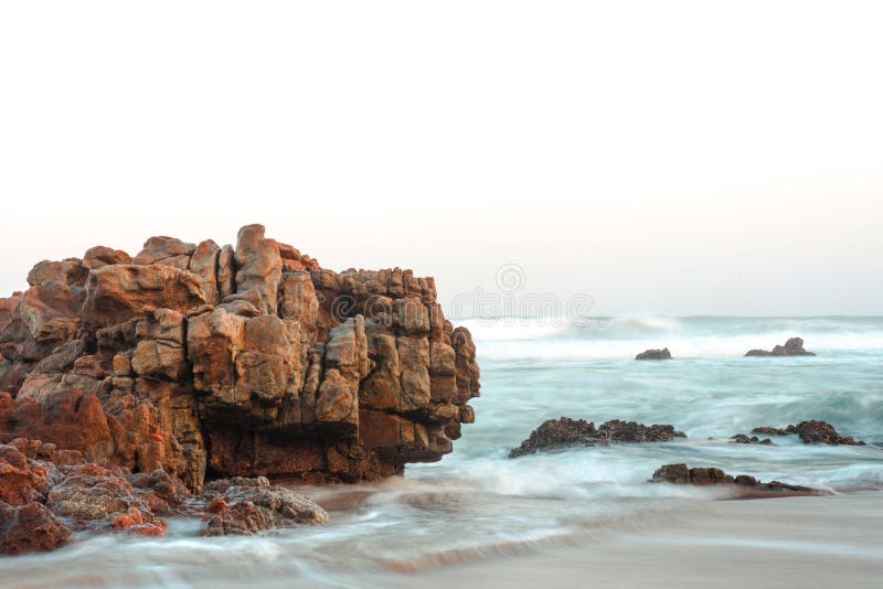 Stunning Shot of a Beach with Rock Formations by the Shore on a Bright ...