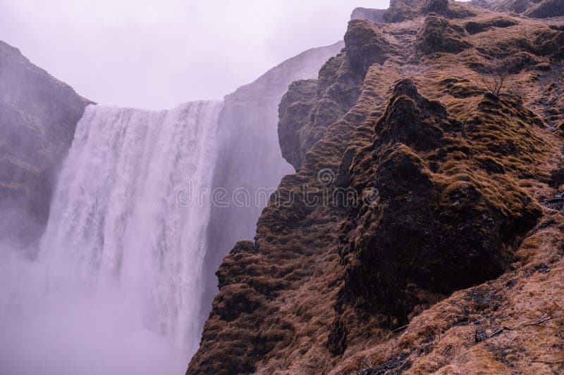 Stunning Shot of a Tall, Cascading Waterfall between Cliffs Stock Image ...