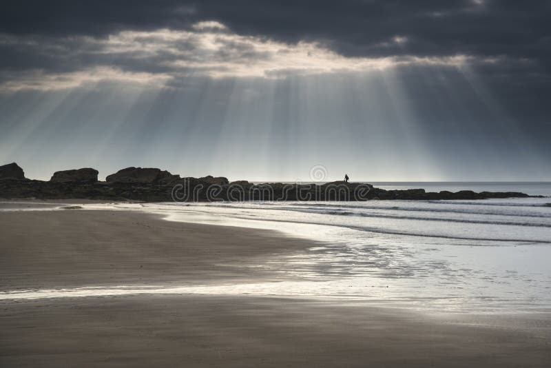 Stunning Sun Rays Bursting from Sky Over Empty Yellow Sand Beach Stock ...