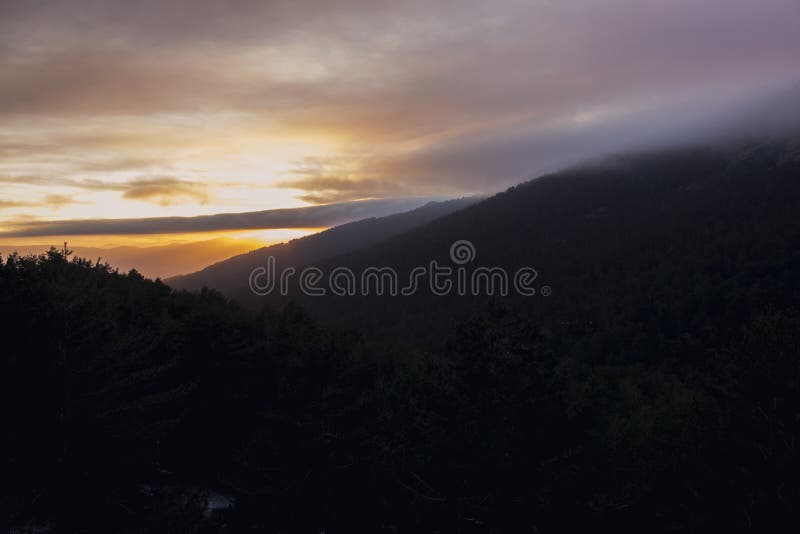 Stunning Sunset between Mountains Stock Image - Image of orange, forest ...