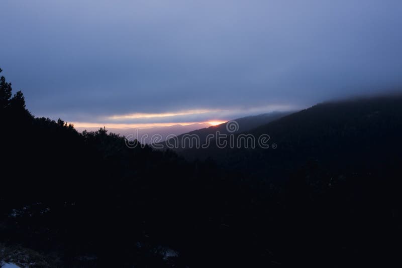 Stunning Sunset between Mountains Stock Photo - Image of park, mist ...