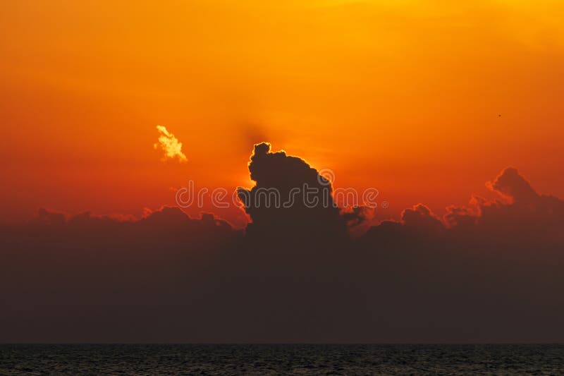 A Stunning Sunset View with Vibrant Orange Skies and Dramatic Cloud ...