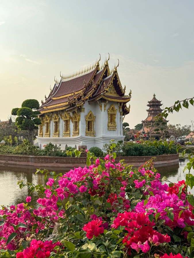 A Stunning Temple Set Against a Backdrop of Blooming Flowers by the ...