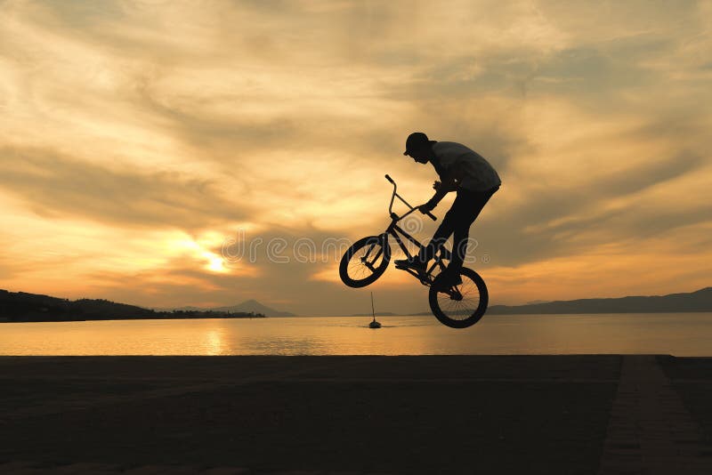 Bmx Biker Tricks Against A Beautiful Sunset. Stock Image - Image of ...
