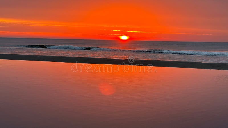 Stunning View of a Bright Vibrant Sunset Sky Over a Sea Stock Photo ...