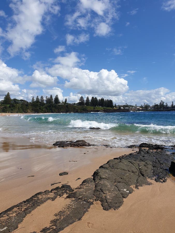 Stunning View Featuring a Sandy Beach with a Few Large Rocks Stock ...