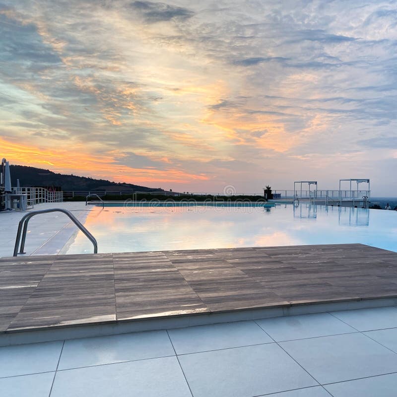 Stunning View of a Pool Reflecting the Mesmerizing Sunset Stock Photo ...