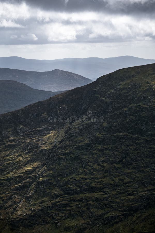 Stunning View of Rolling Mountains Under Soft Cloudy Sky in Serene ...