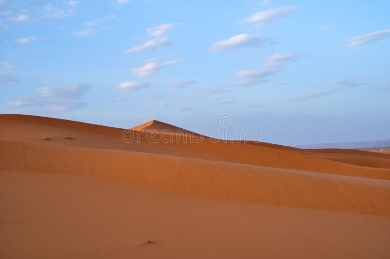 Stunning View of a Sandy Desert Dune Surrounded by a Clear Blue Sky ...