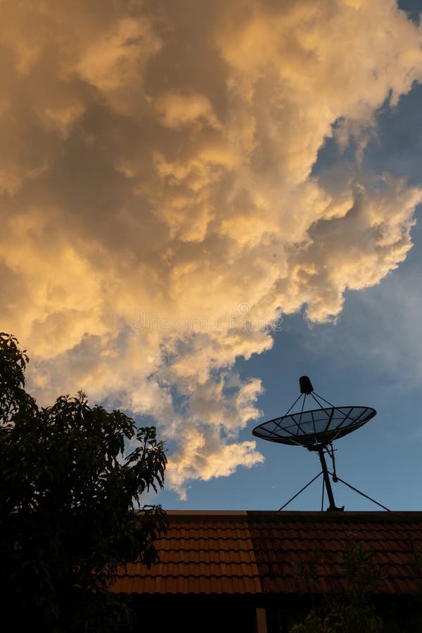A Stunning View of a Satellite Dish Against a Dramatic Sky Filled with ...