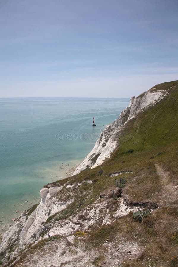 An Empty Field Next To the Edge of the Ocean and Some Cliff Stock Photo ...