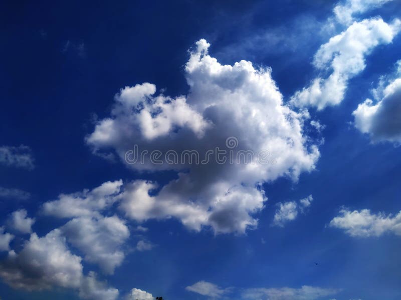 A Stunning View, White Clouds Hit by the Sun Against a Blue Sky. Stock ...