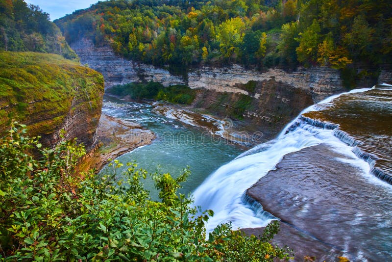 Stunning Waterfall on Edge Pouring into Huge Canyon with Cliffs and ...