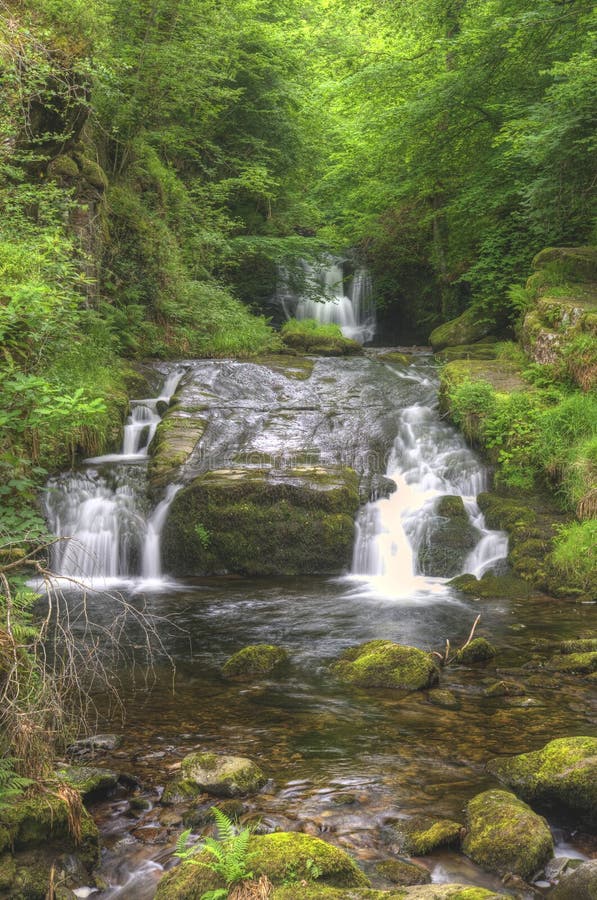 Stunning Waterfall Flowing Over Rocks in Forest Stock Image - Image of ...