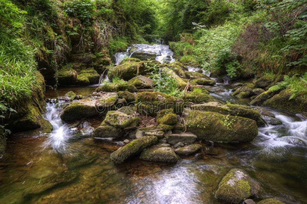 Stunning Waterfall Flowing Over Rocks in Forest Stock Image - Image of ...