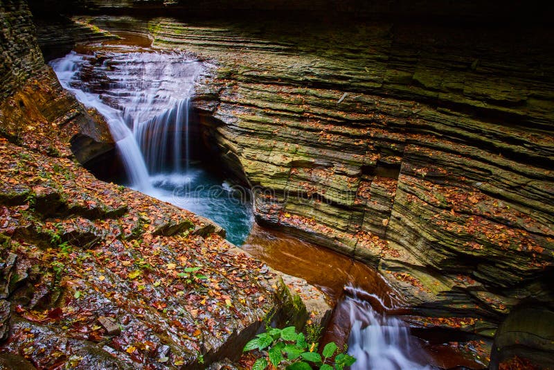 Stunning Waterfall through Terraced Rocks Covered in Fall Foliage Stock ...