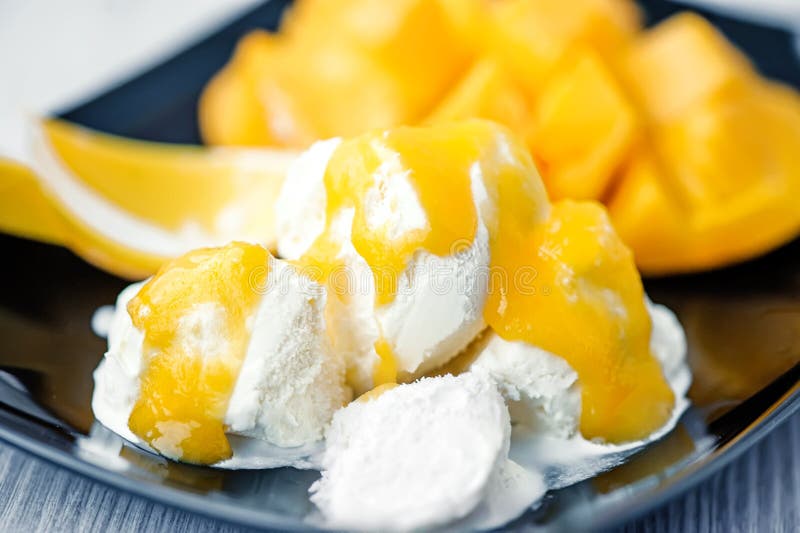 Stunning White Ice Cream with a Sauce of Ripe Mango. Close-up Stock ...