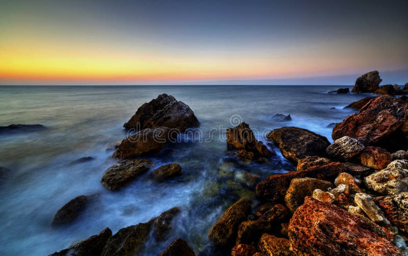 Beautiful Sunrise Over Rocky Shore Stock Photo - Image of scenic ...