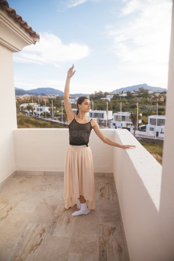 A Stunningly Elegant Ballet Pose Captured Beautifully on a Scenic ...