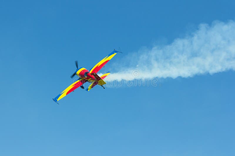 Stunt Plane Flying Against Clear Blue Sky. Editorial Stock Image ...