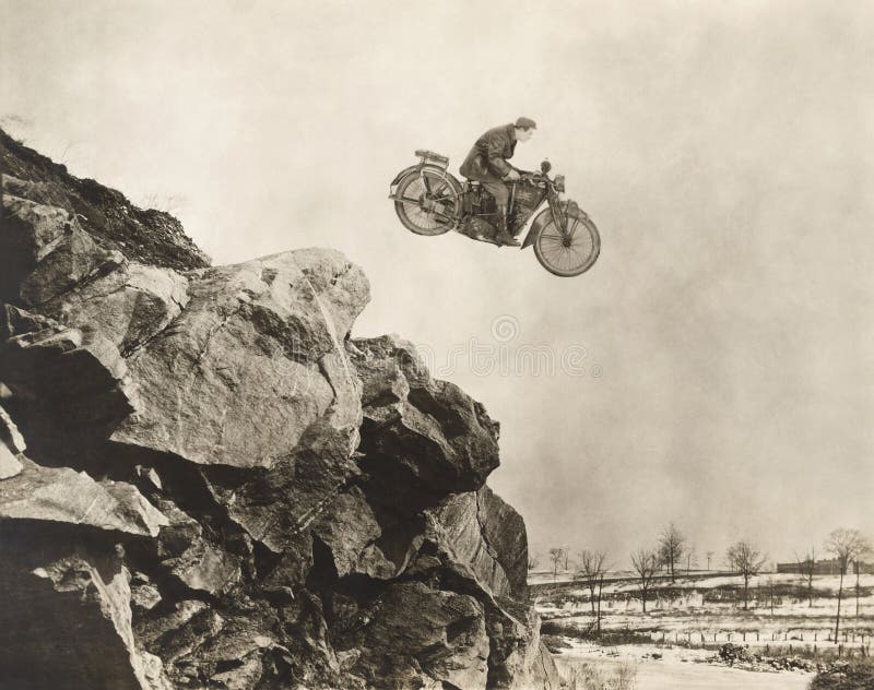 Stuntman on Motorbike Flying Over Cliff Stock Photo - Image of looking ...