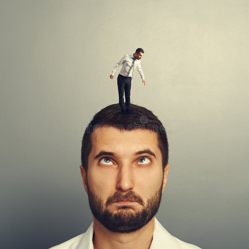 Stupid Man with Small Man on the Head Stock Photo - Image of bewildered ...