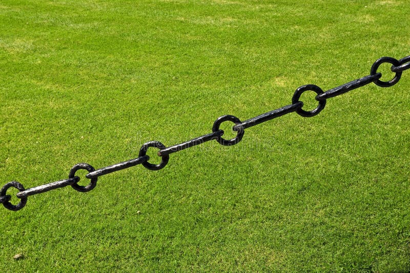 Sturdy Iron Chain on the Background of a Green Lawn Stock Image - Image ...