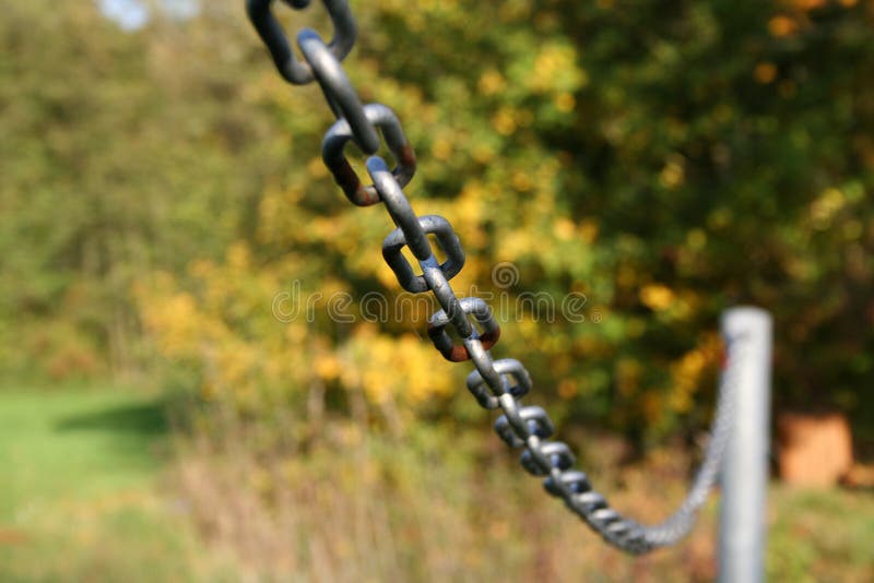 Sturdy Chain of Iron on a Lawn Stock Photo - Image of boundary, border ...