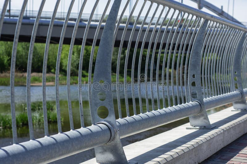 A Sturdy Metal Railing is Bolted To a Concrete Base Stock Photo - Image ...