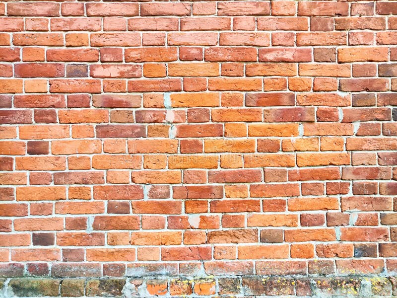 The Sturdy Red Brick Wall Displays a Unique Pattern with Weathered ...