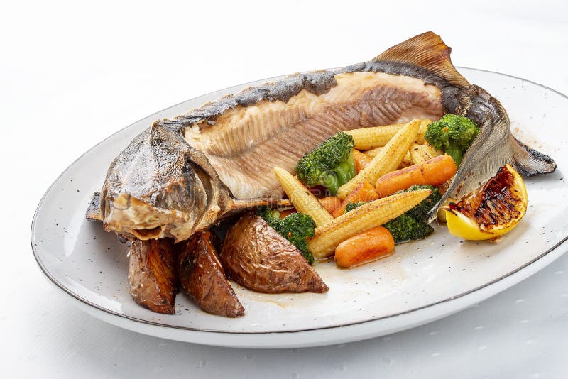 Sturgeon Baked with Vegetables and Red Caviar Stock Photo - Image of ...