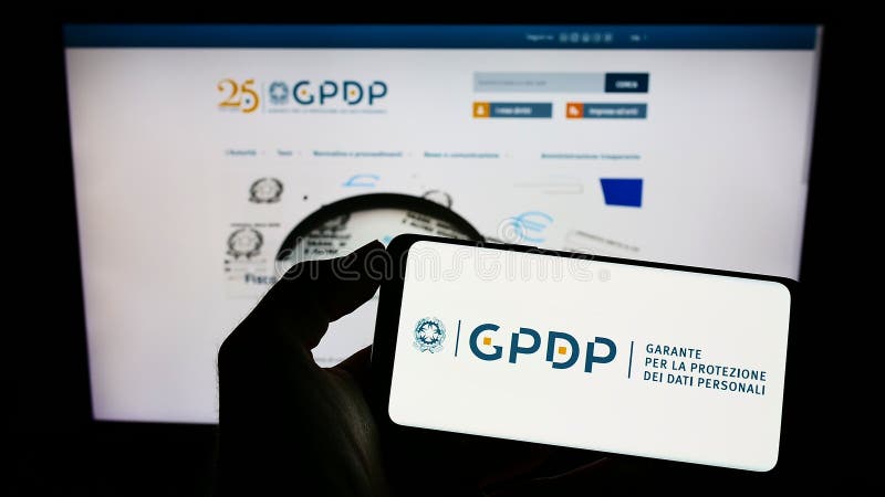 Person Holding Cellphone with Logo of Italian Data Protection Authority ...