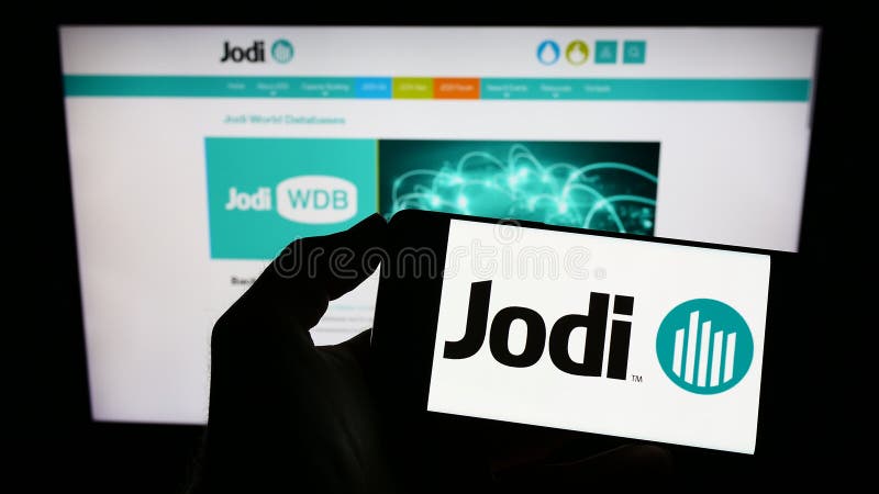 Person Holding Cellphone with Logo of Joint Organisations Data ... Person Holding Cellphone with Logo of Joint Organisations Data ...