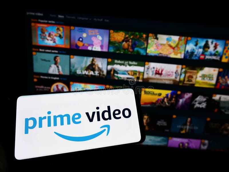 Person Holding Cellphone with Logo of US Streaming Service Amazon Prime ...