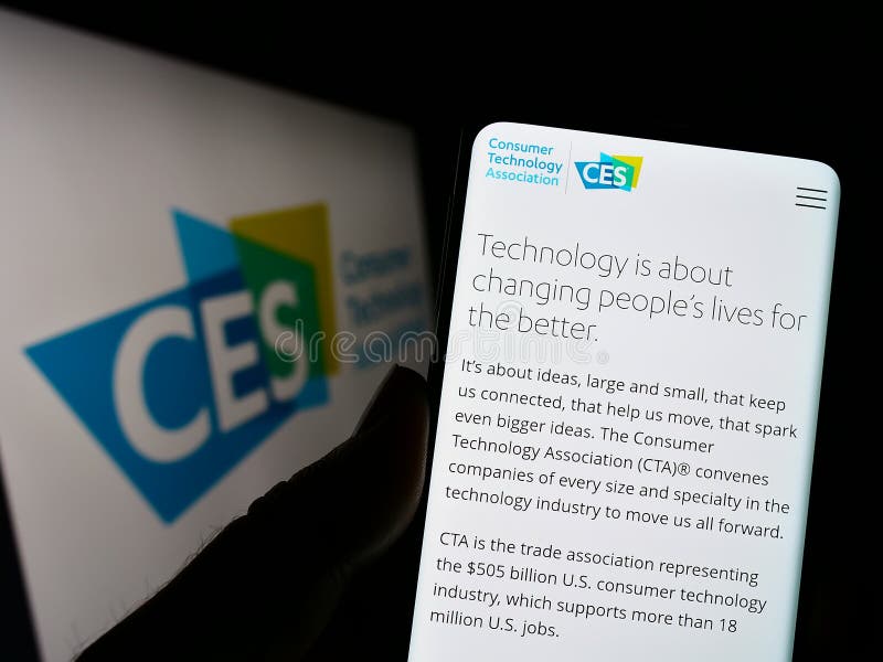 Person Holding Cellphone with Webpage of US Consumer Technology ...