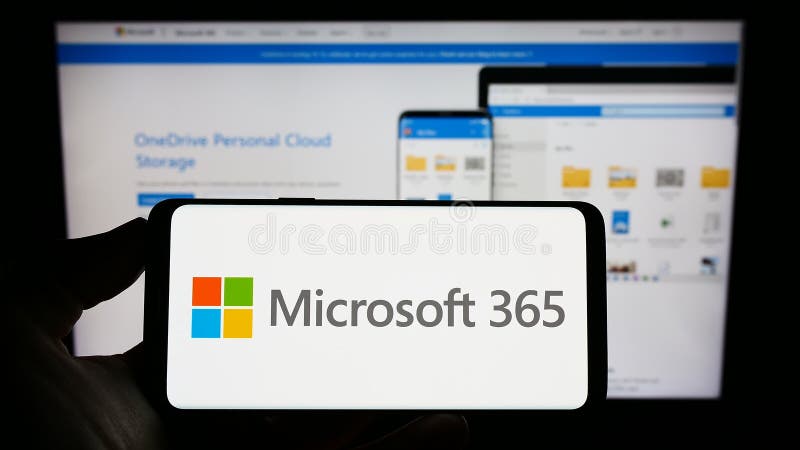 Person Holding Mobile Phone with Logo of Productivity Software ...