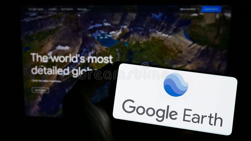 Person Holding Mobile Phone with Logo of Satellite Imagery Software ...