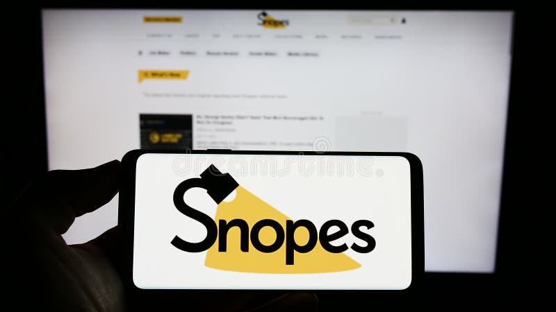 Person Holding Mobile Phone with Logo of US Fact Checking Platform ...