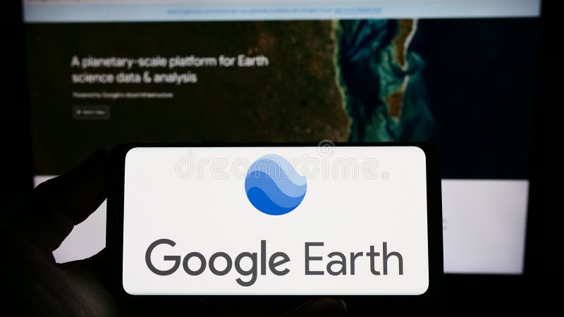 Person Holding Smartphone with Logo of Satellite Imagery Software ...