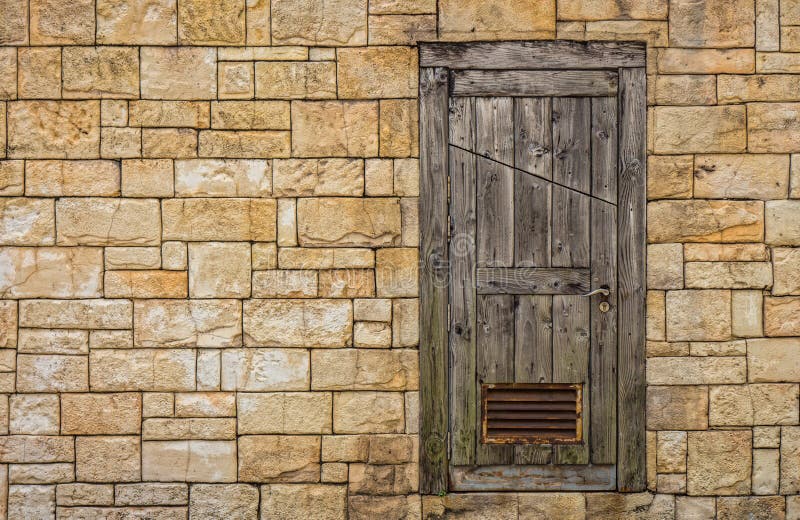 Old Rectangular Yellow Dry Stone Wall with Wooden Door Stock Image ...