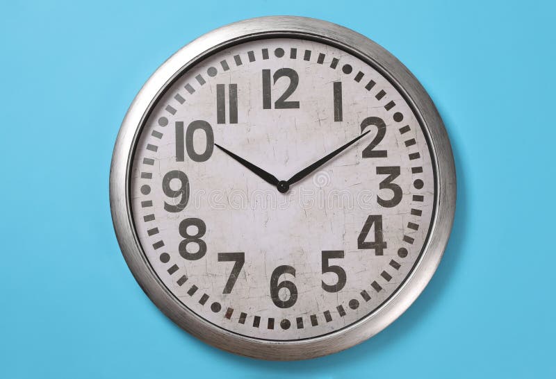 Stylish Analog Clock Hanging on Light Blue Wall Stock Image - Image of ...