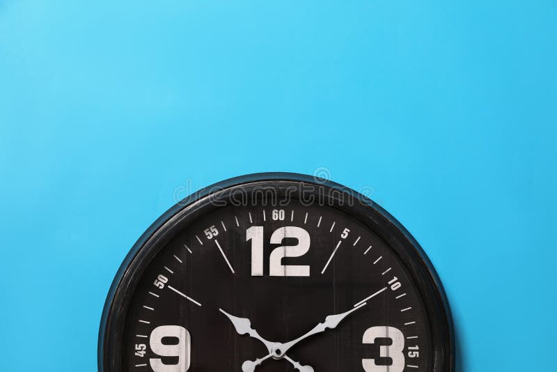 Stylish Analog Clock Hanging on Light Blue Wall, Space for Text Stock ...
