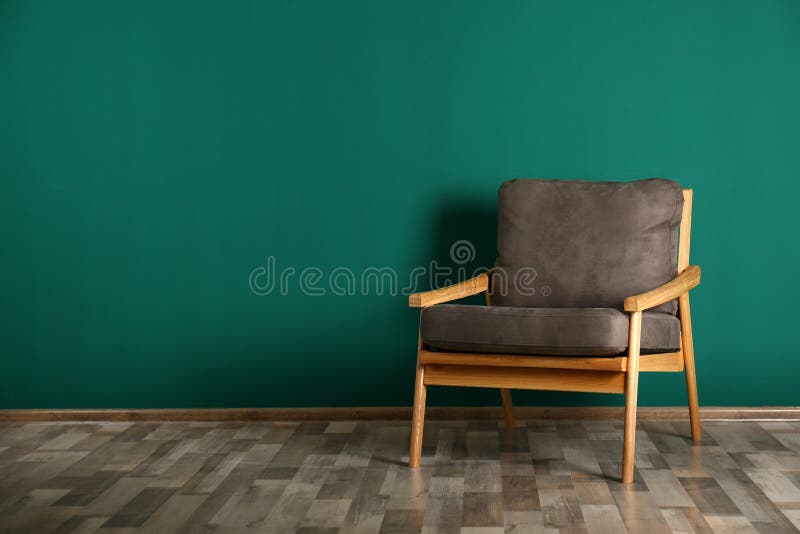 Stylish Armchair Near Color Wall. Interior Design Stock Image - Image ...