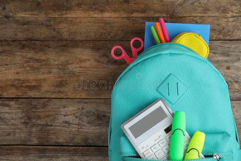 Stylish Backpack with Different School Stationary on Wooden Table, Top ...