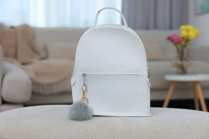 Stylish Backpack with Faux Fur Keychain on Soft Surface Indoors Stock ...