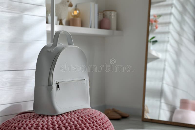Stylish Backpack on Pouf in Dressing Room Stock Photo - Image of ...
